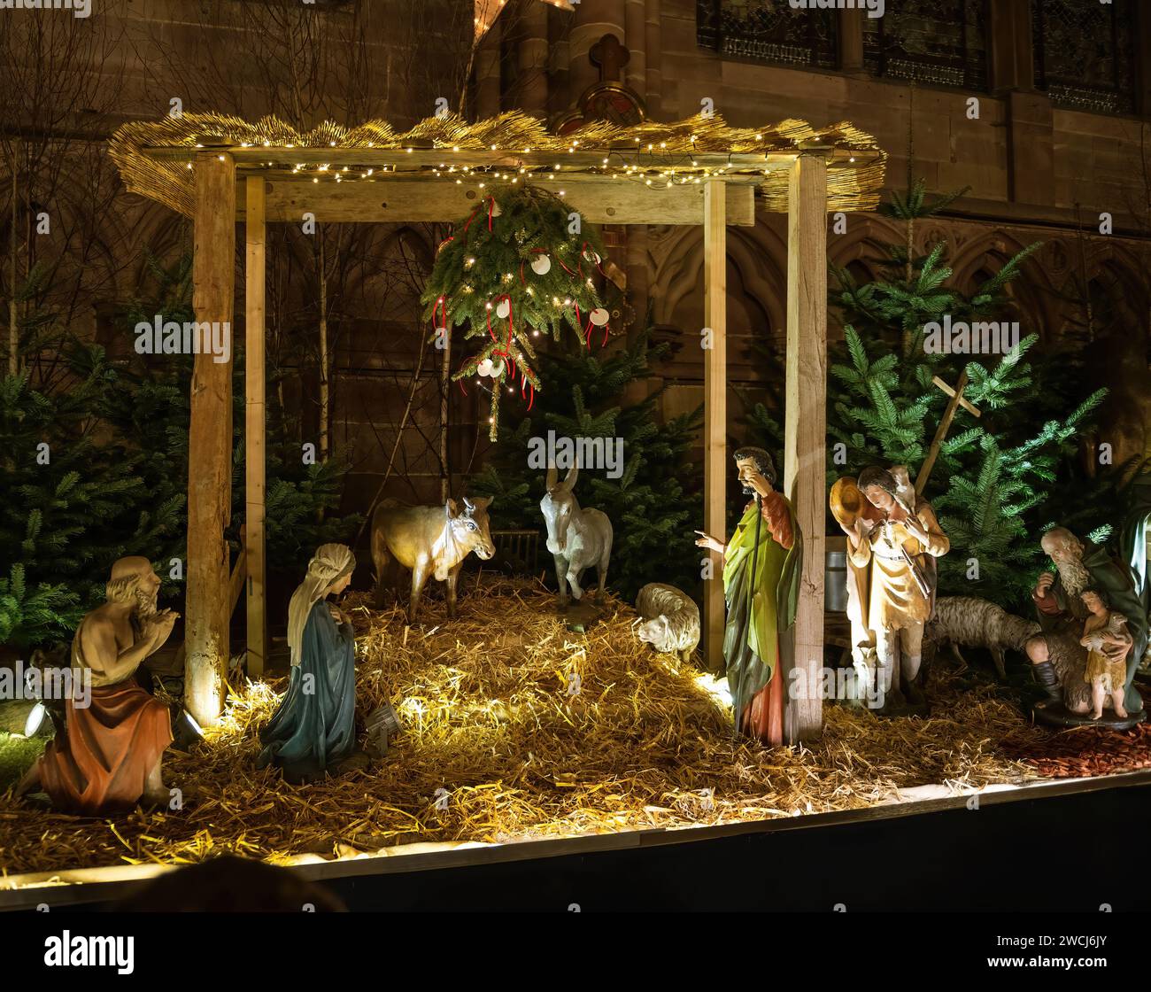 A beautifully illuminated nativity scene unfolds within the historic ...