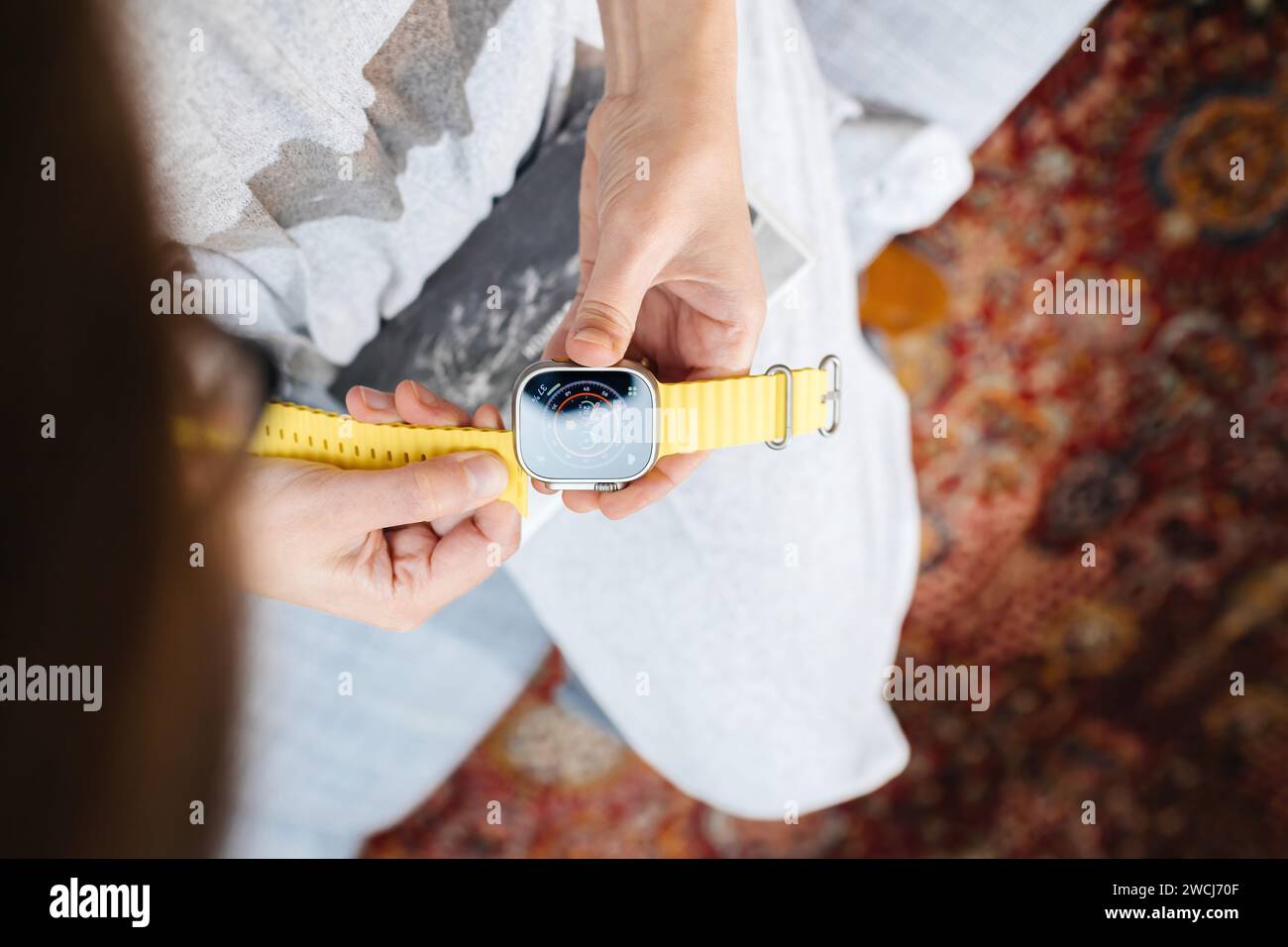London, United Kingdom - Sep 28, 2022: A woman measures her Apple Watch ...