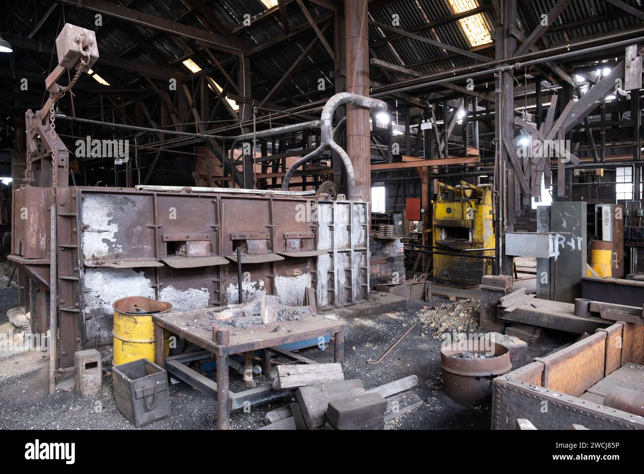 Interior of the Blacksmith Shop where men worked, shaping heated metal ...