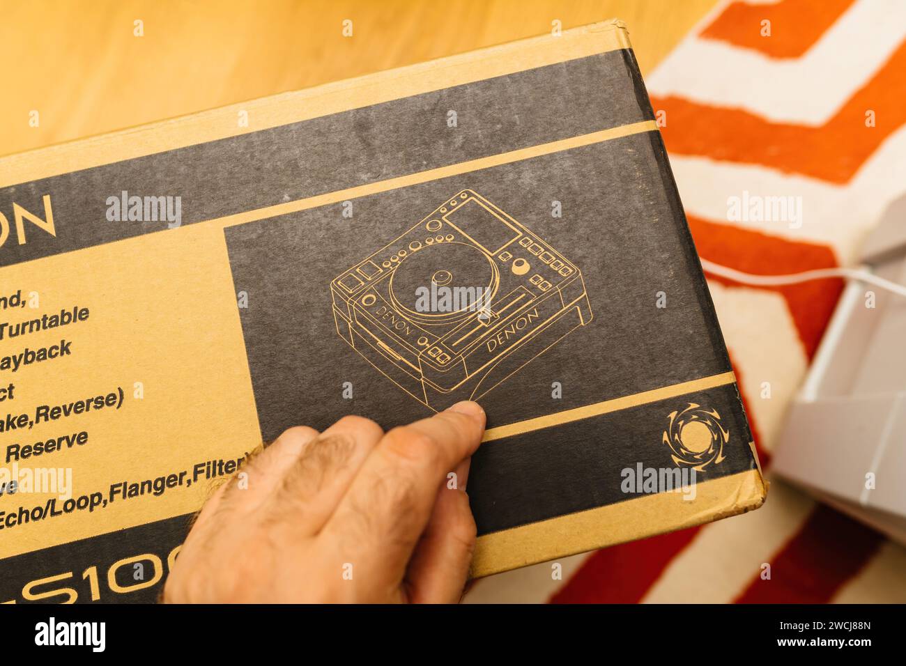 Paris, France - Oct 24, 2023:A male hand pointing to the new cardboard ...