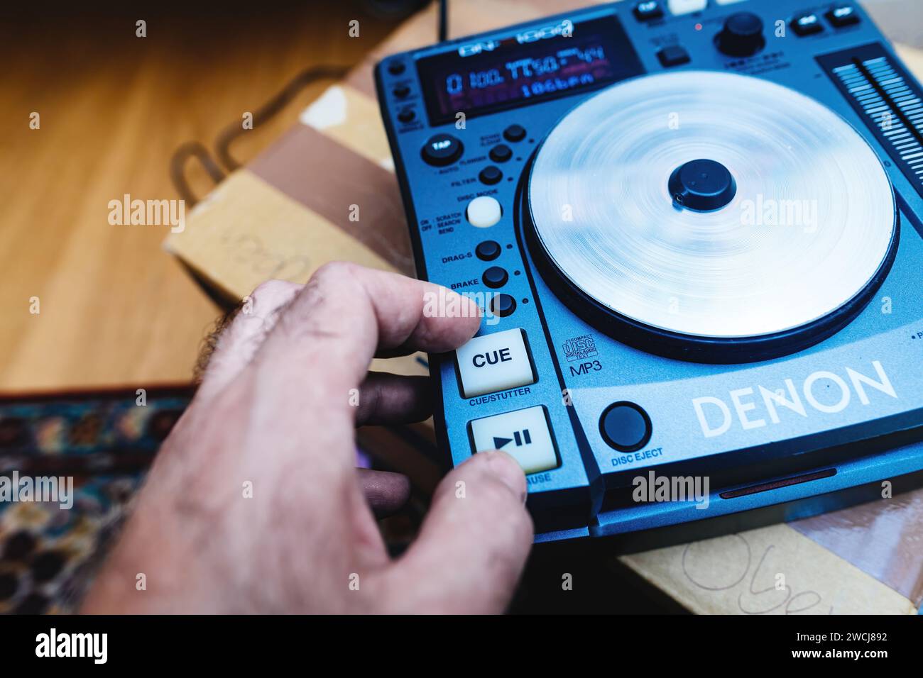 Paris, France - Oct 24, 2023: Close-up view of a DJ's blue Denon mixing ...
