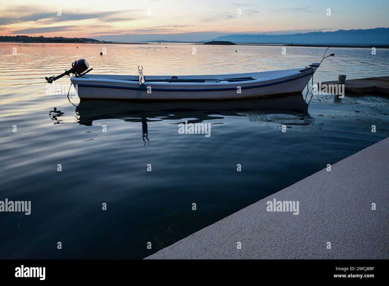 old boat in dock at sunset Stock Photo - Alamy