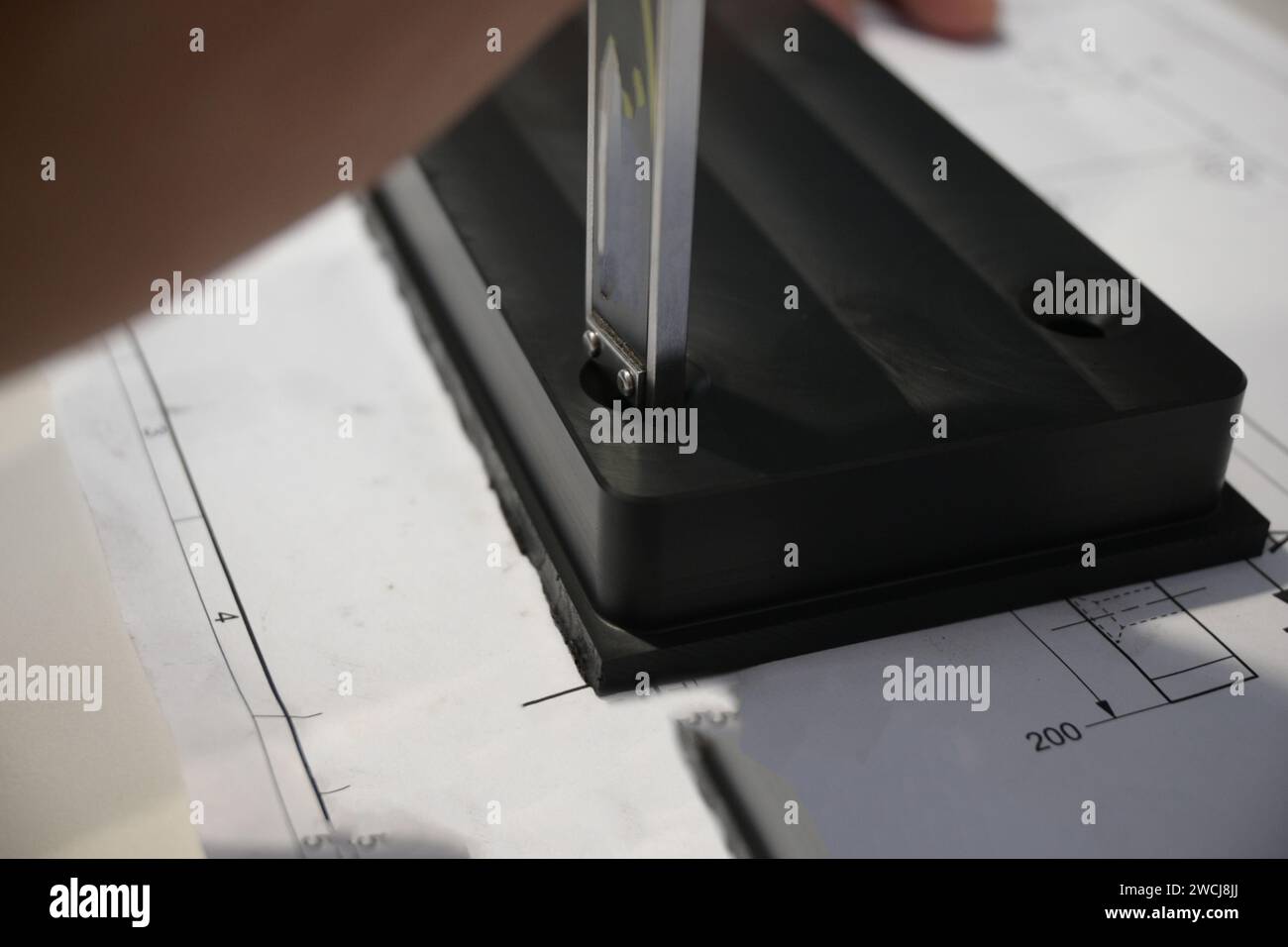 measuring the finished plastic product using a caliper Stock Photo - Alamy