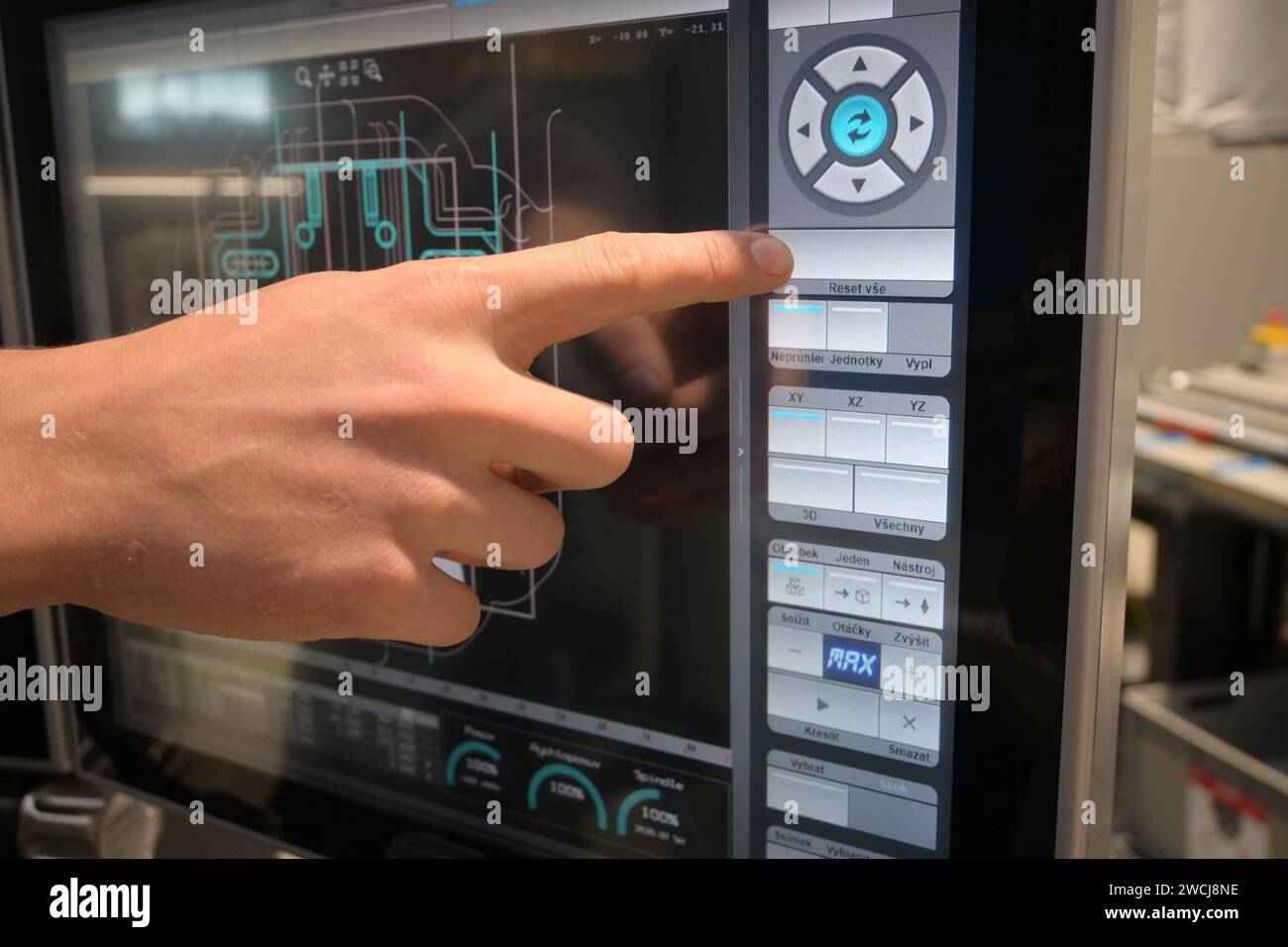 cnc monitor when displaying the program, the worker points with his ...