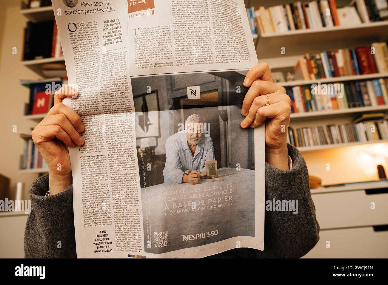 Frankfurt, Germany - Dec 20, 2023: A woman engages with a Nespresso ...