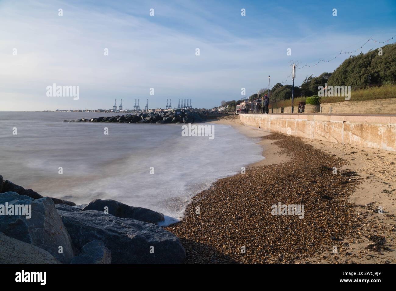 View along the promenade at Felixstowe beach looking towards the port ...