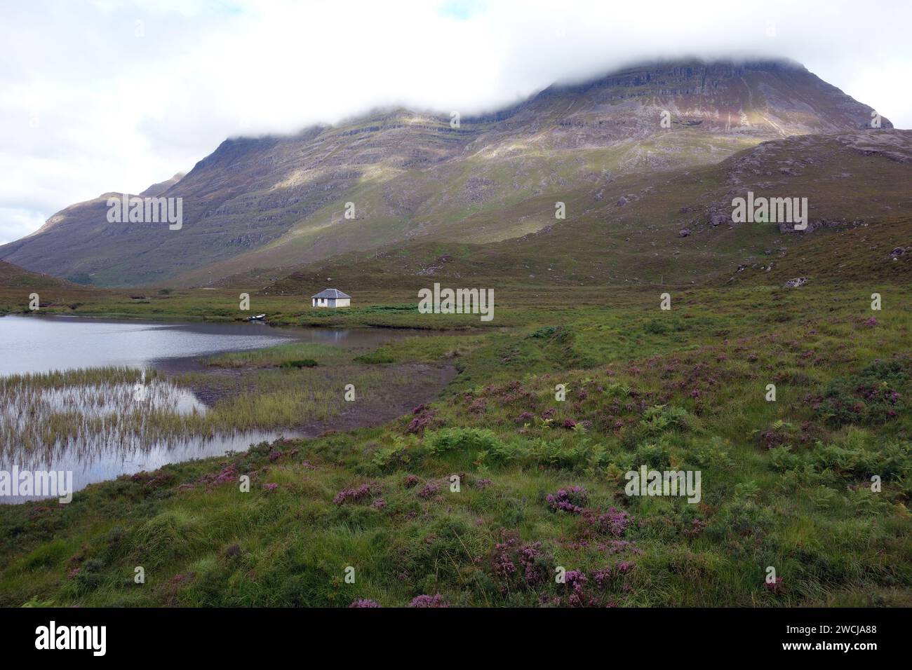 The Boat House on 'Lochan an asgair' in with the Munro 'Liathach ...
