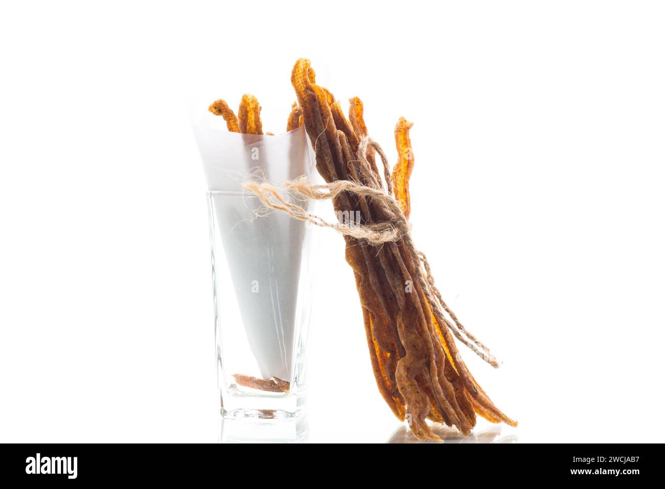 A handful of dried chicken meat, marinated with spices, isolated on a ...