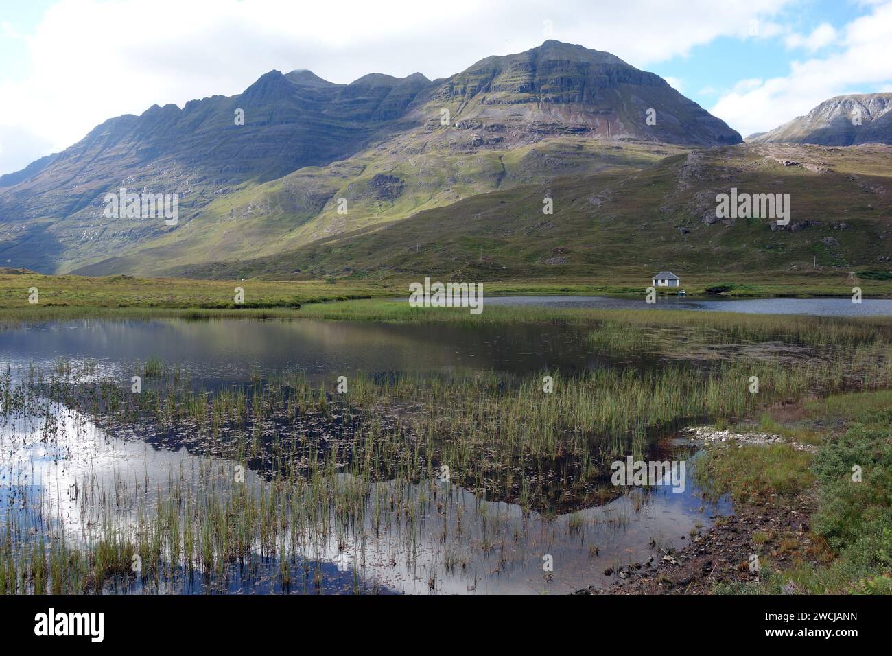 The Boat House on 'Lochan an asgair' in with the Munro 'Liathach ...