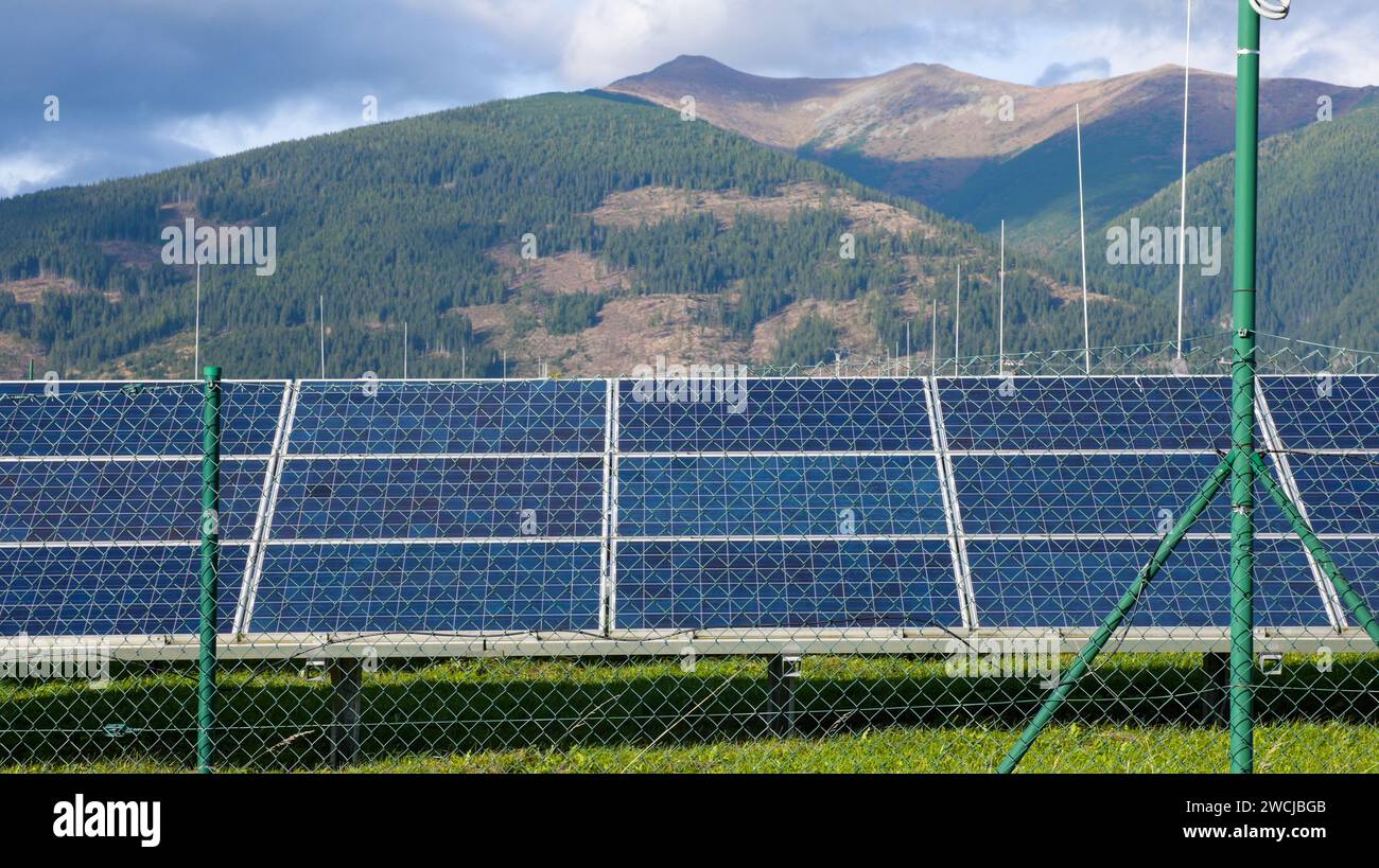 view of the solar farm with the background of the Slovak hills (Baranec ...
