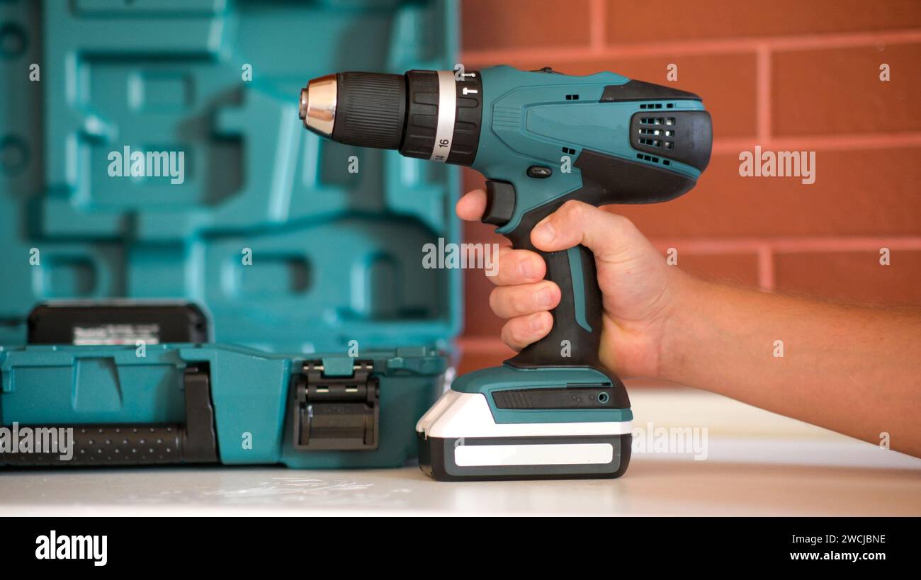 Female handyman drill hi-res stock photography and images - Alamy