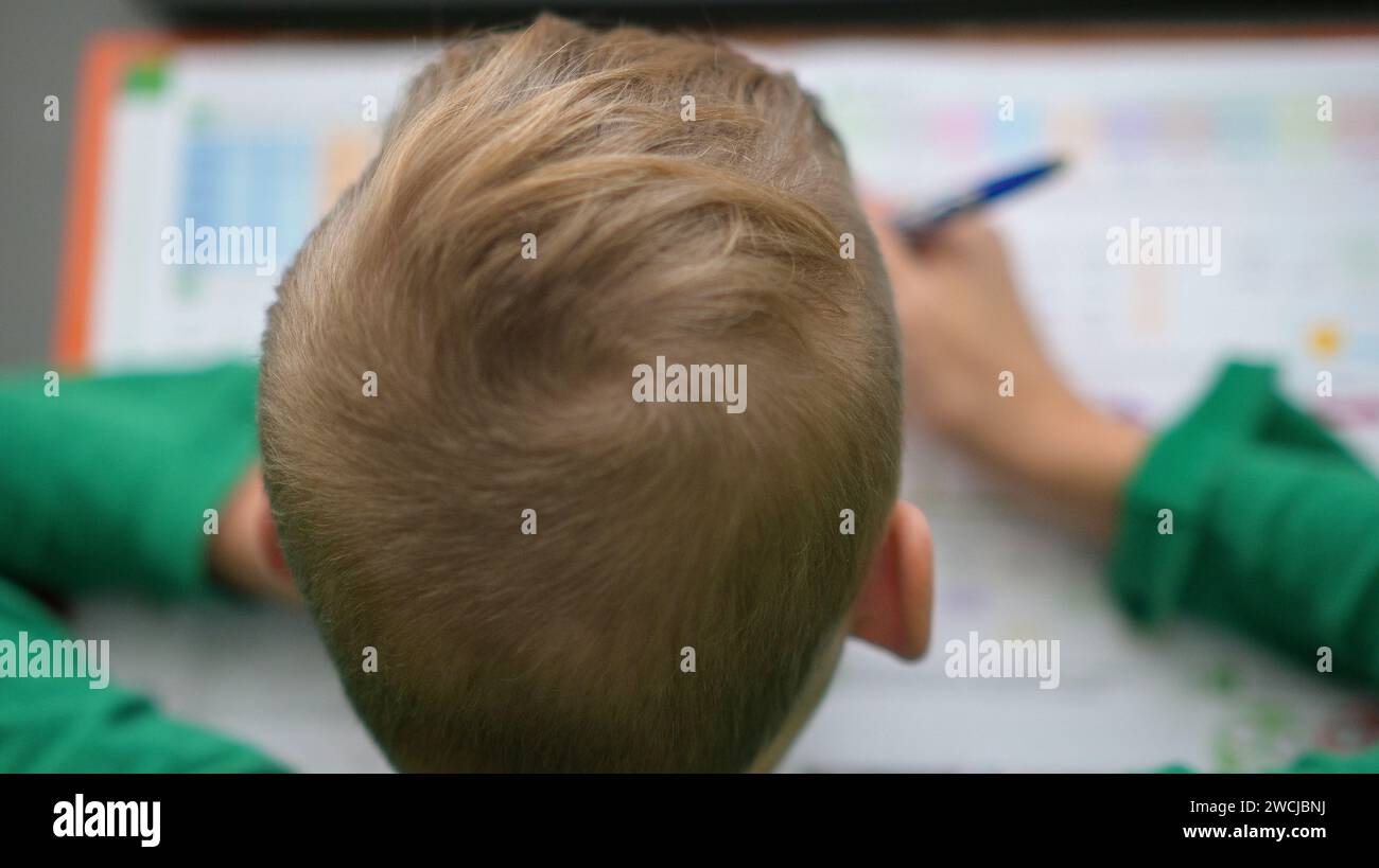 boy doing homework from school, top view and blurred background Stock ...