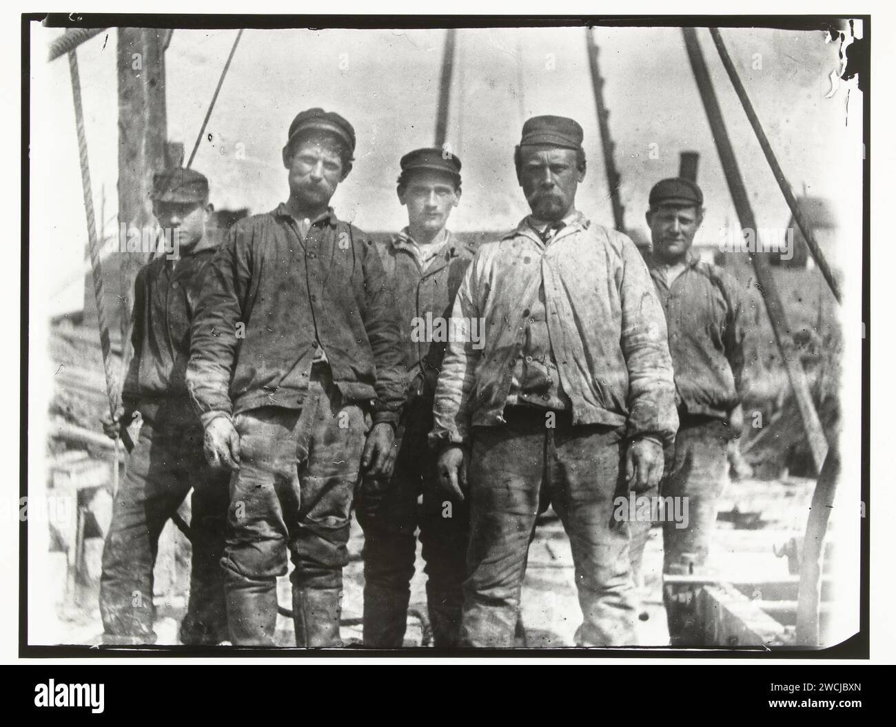 Group portrait of workers at the Van Diemenstraat in Amsterdam, George ...
