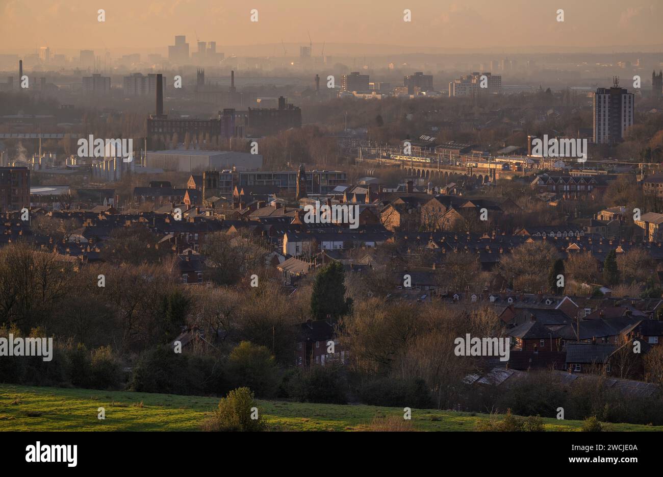 General view of factories and residential housing with the Manchester ...