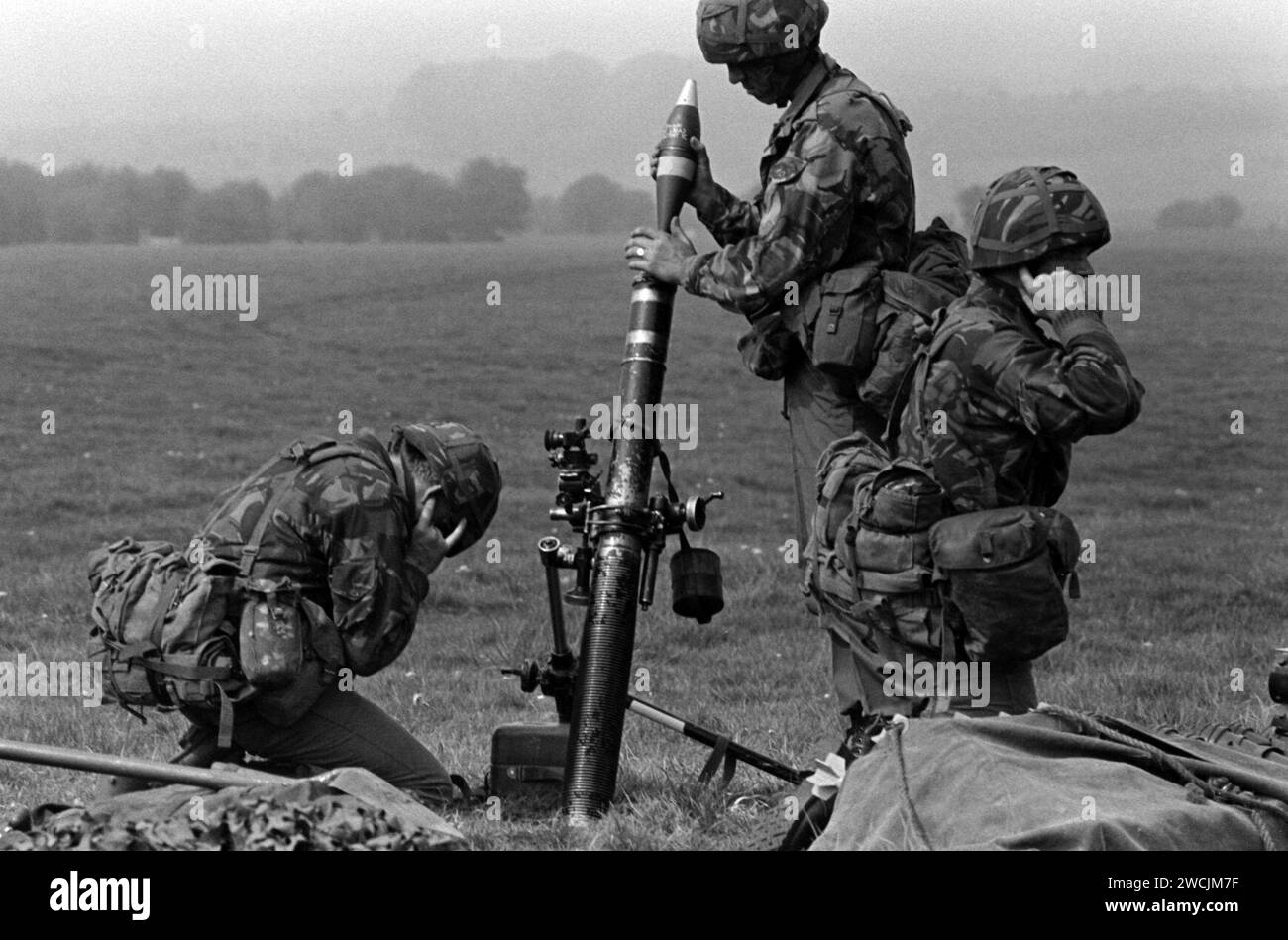 A Belgian commando battery loads an M29 81 mm mortar during NATO ...