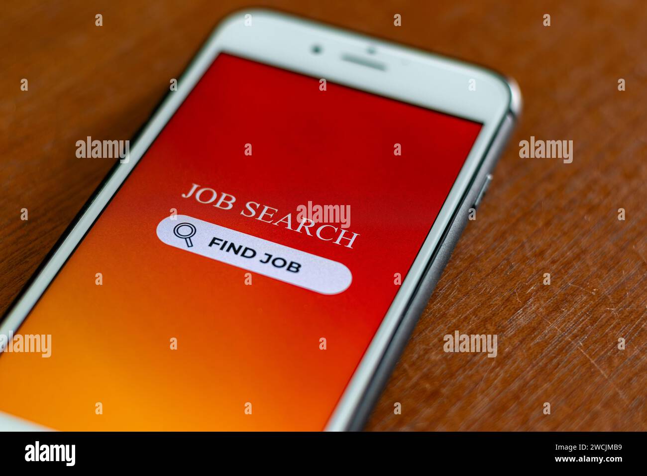 Job Search Concept. Smartphone with job search app on screen. Browsing job opportunities online ...