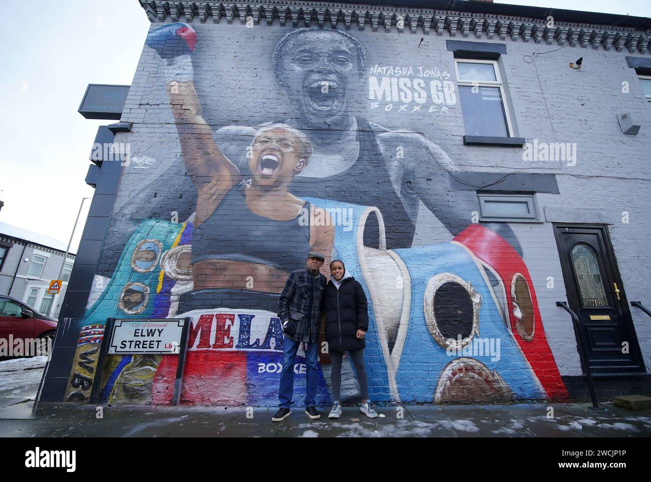 Howard Gayle and Natasha Jonas stand in front of her mural painted by ...