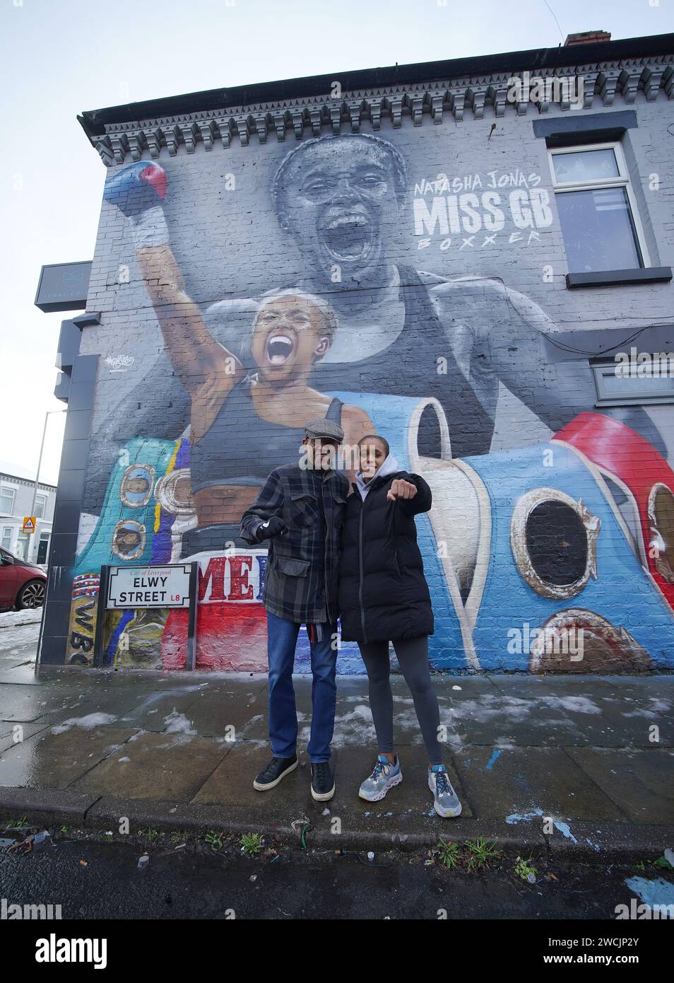 Howard Gayle and Natasha Jonas stand in front of her mural painted by ...