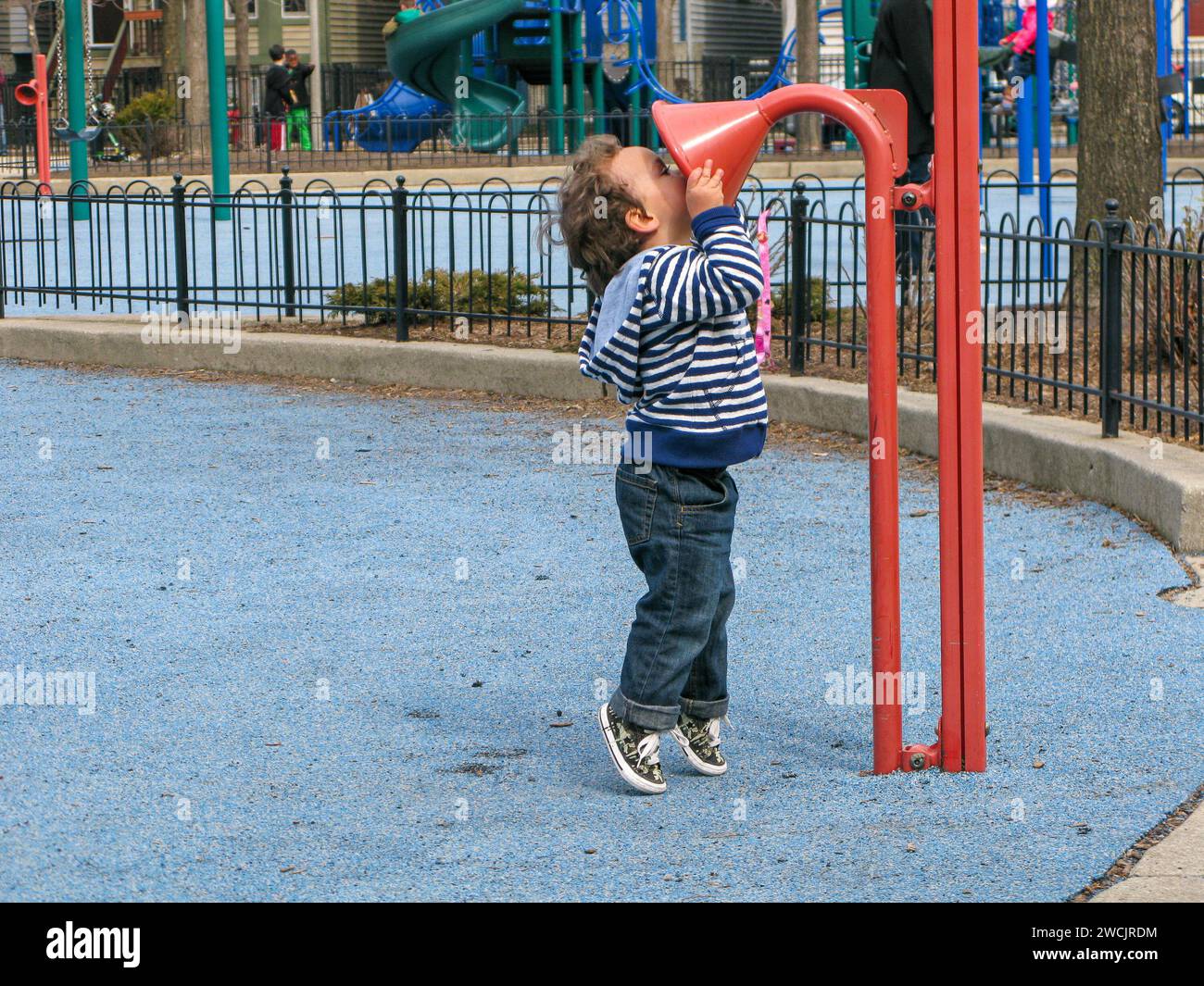 Young Child Playing with Outdoor Speaking Tube Stock Photo - Alamy