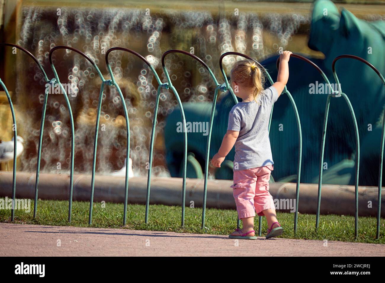 Child by a fountain hi-res stock photography and images - Alamy