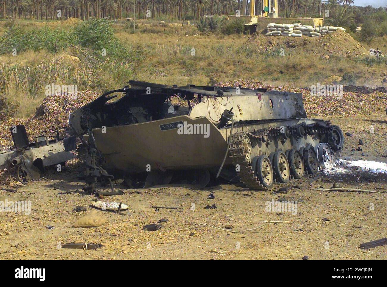 A destroyed Iraqi BMP-2 Infantry Fighting Vehicle sits in an open field ...