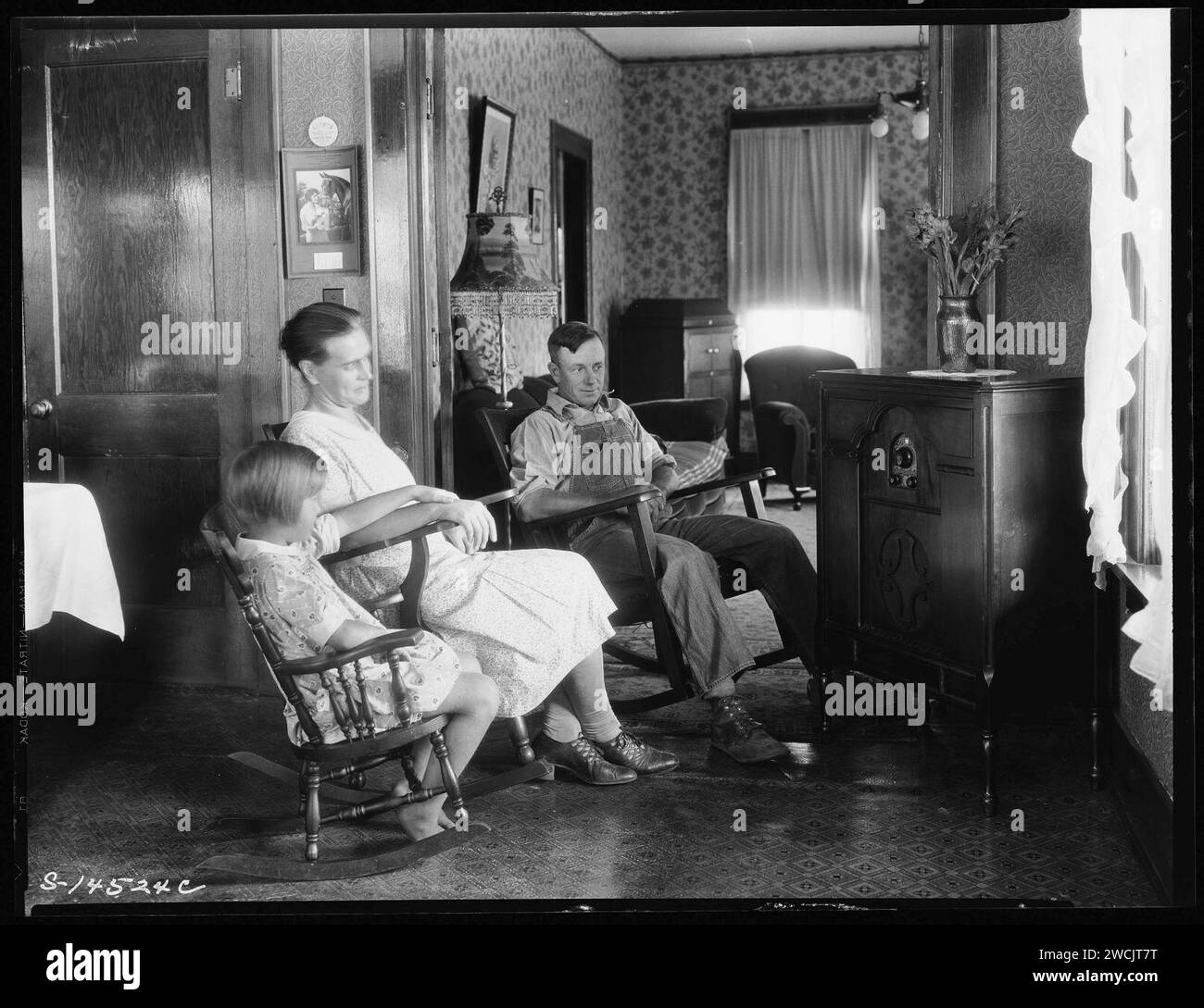 Family is listening to radio Black and White Stock Photos & Images - Alamy