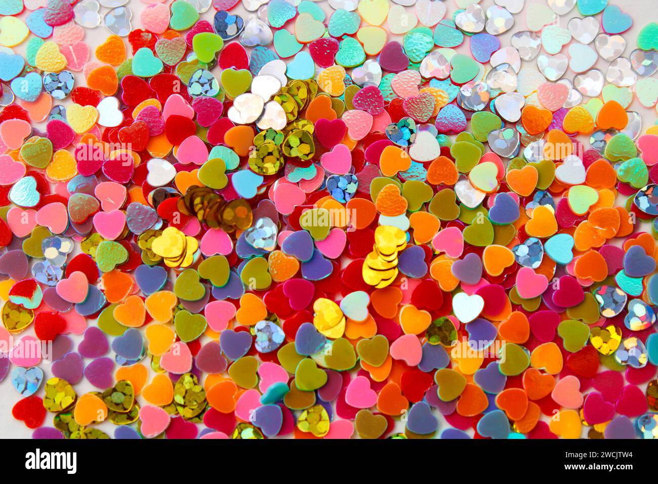 Background with small hearts of many colors Stock Photo - Alamy