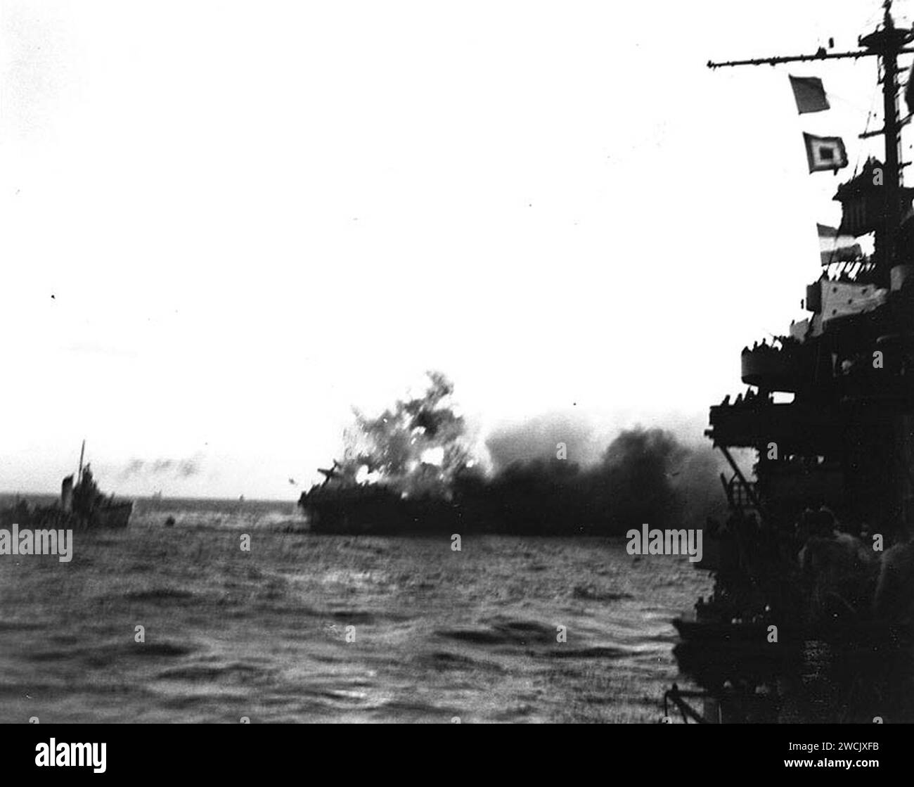 A heavy explosion on board USS Lexington (CV-2) blows an aircraft over ...