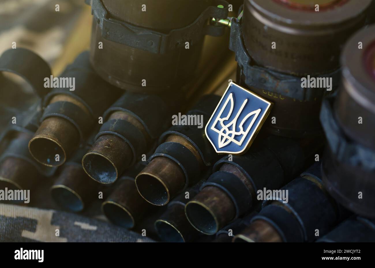 Ukrainian symbol on machine gun belt lies on ukrainian pixeled military ...