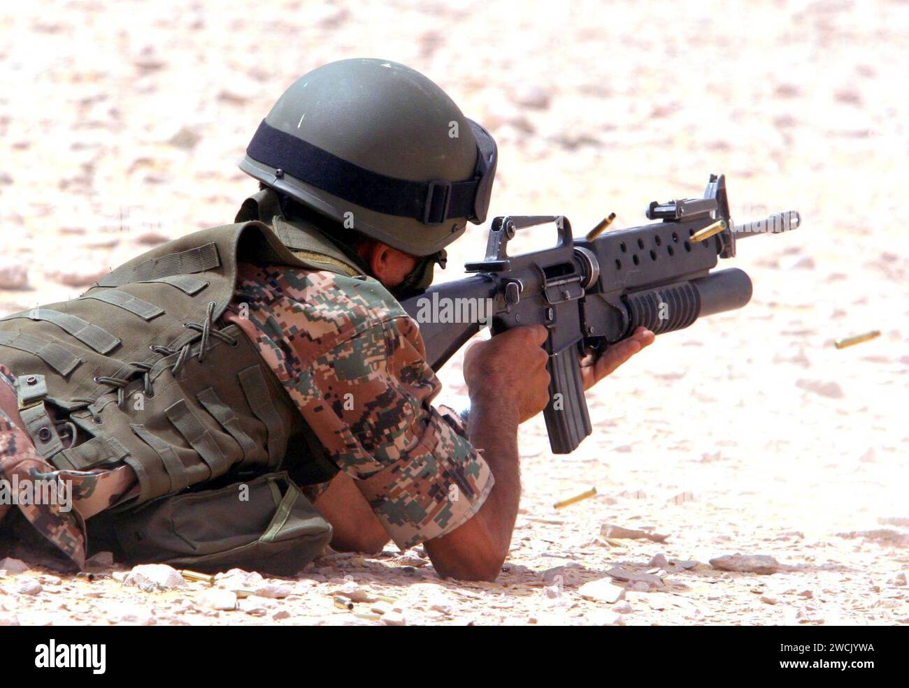 A Jordanian army Soldier fires his weapon on full automatic Stock Photo ...