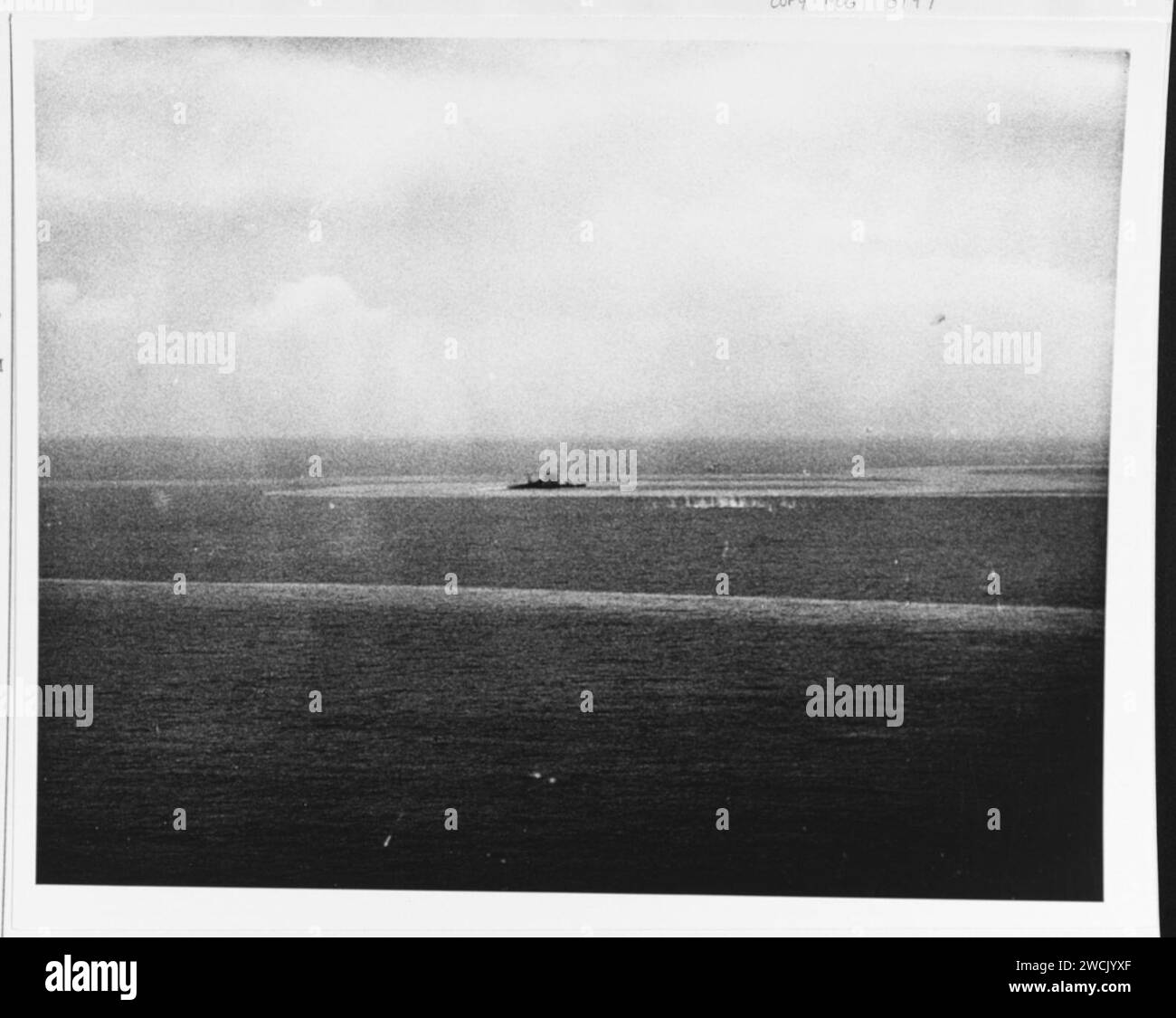 A Japanese Tone-class cruiser fires at attacking planes during the ...