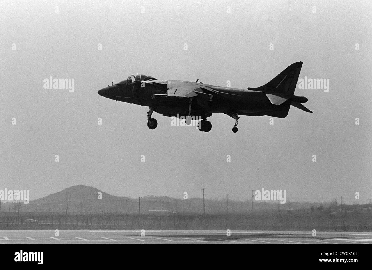 A left side view of an AV-8B Harrier aircraft in flight during the ...