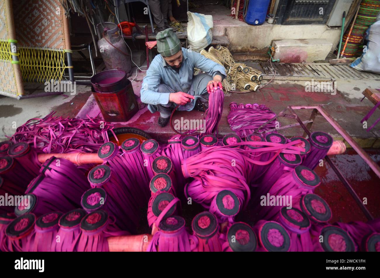 Peshawar, Pakistan. 16th Jan, 2024. A Pakistani man makes handmade ...