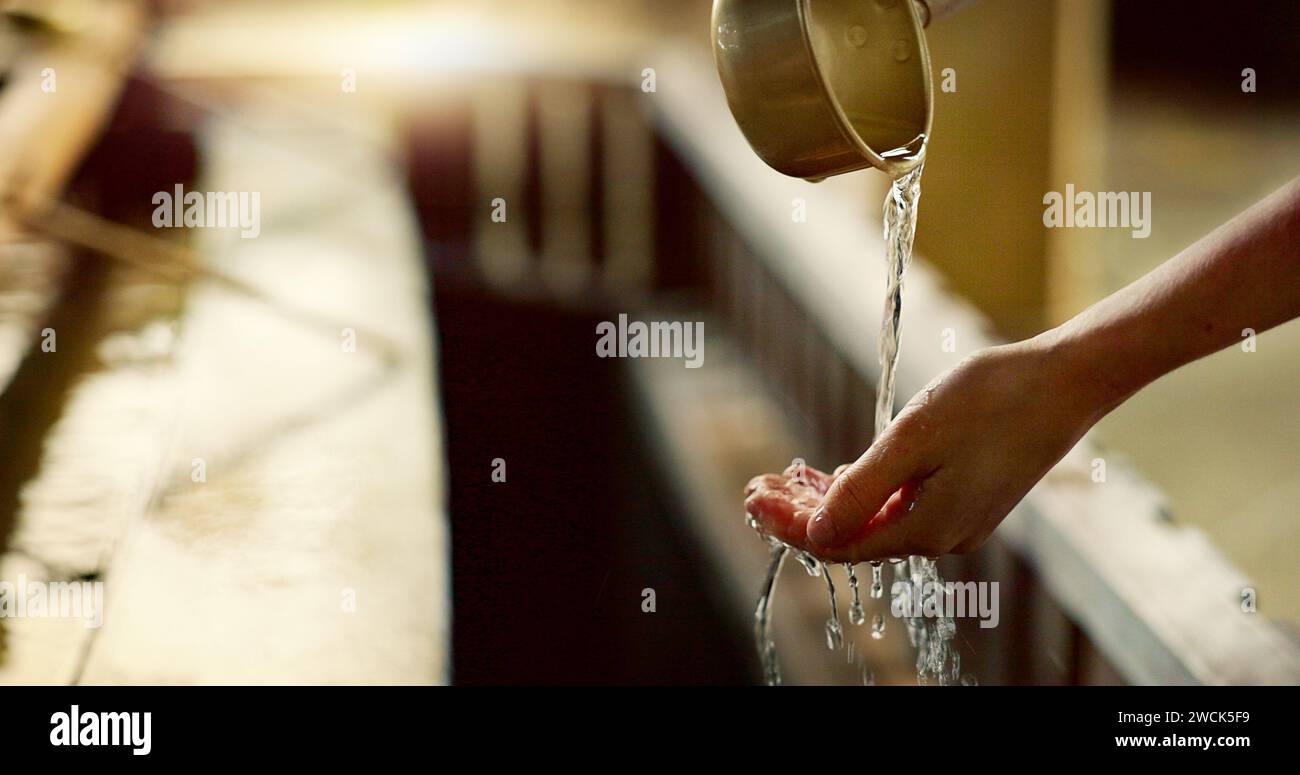 Shinto temple, closeup and washing hands with water in container for ...