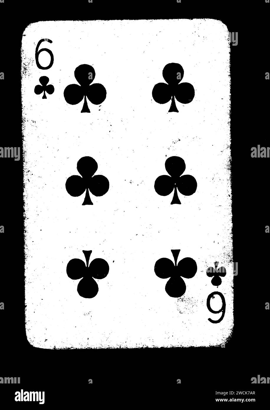 A vintage six of clubs playing card isolated on a black background ...
