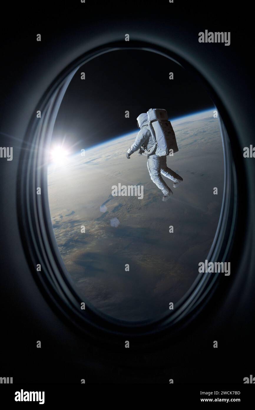 Cosmonaut floating close to Earth planet in spaceship porthole in outer ...