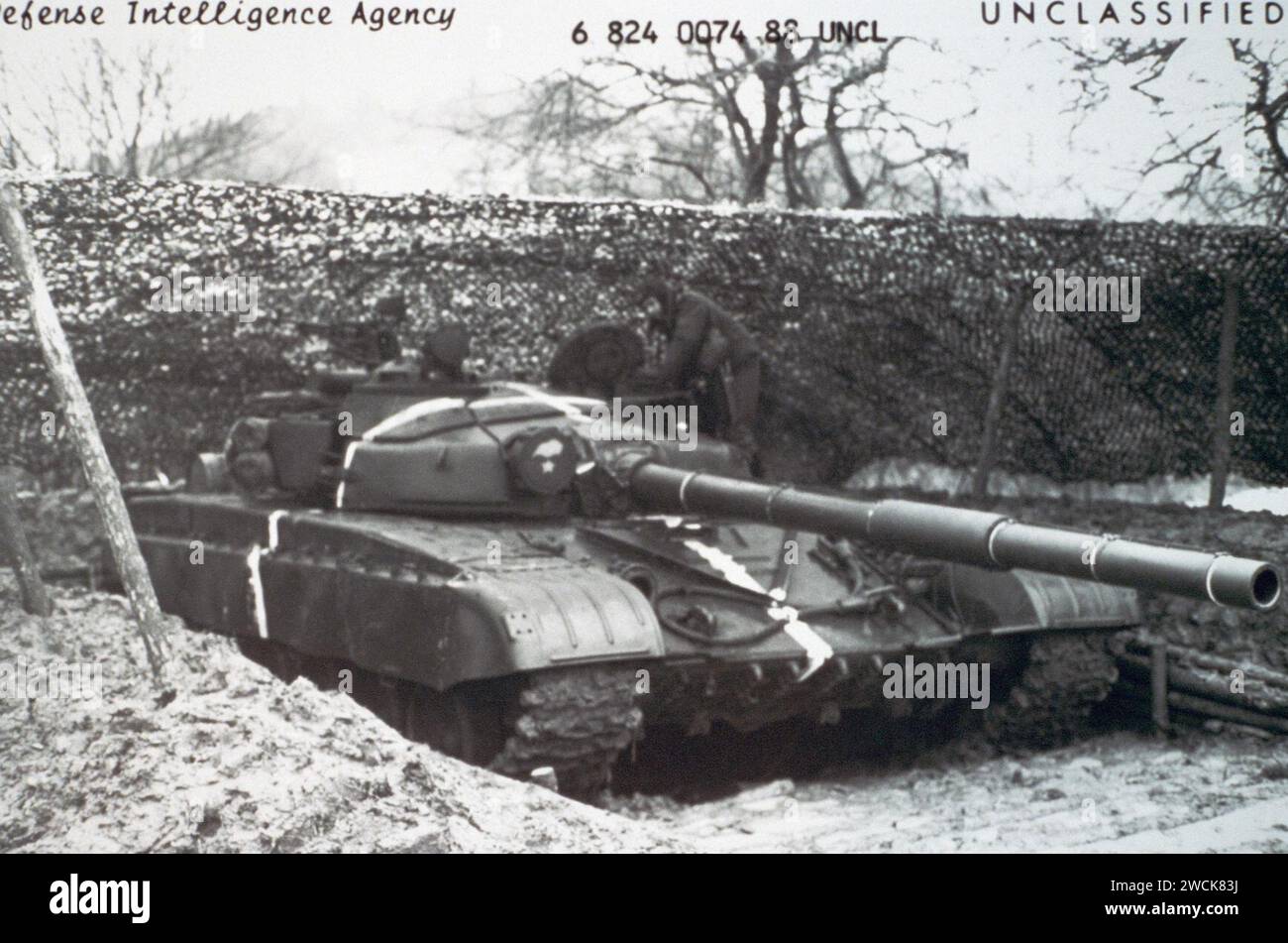 A right front view of a Soviet T74 main battle tank in a dug-in and ...