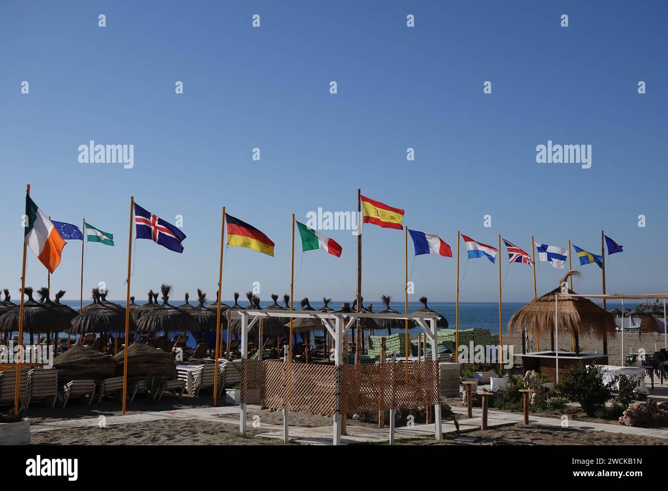Flags of European counties displayed on a beach in the Mediterranean ...
