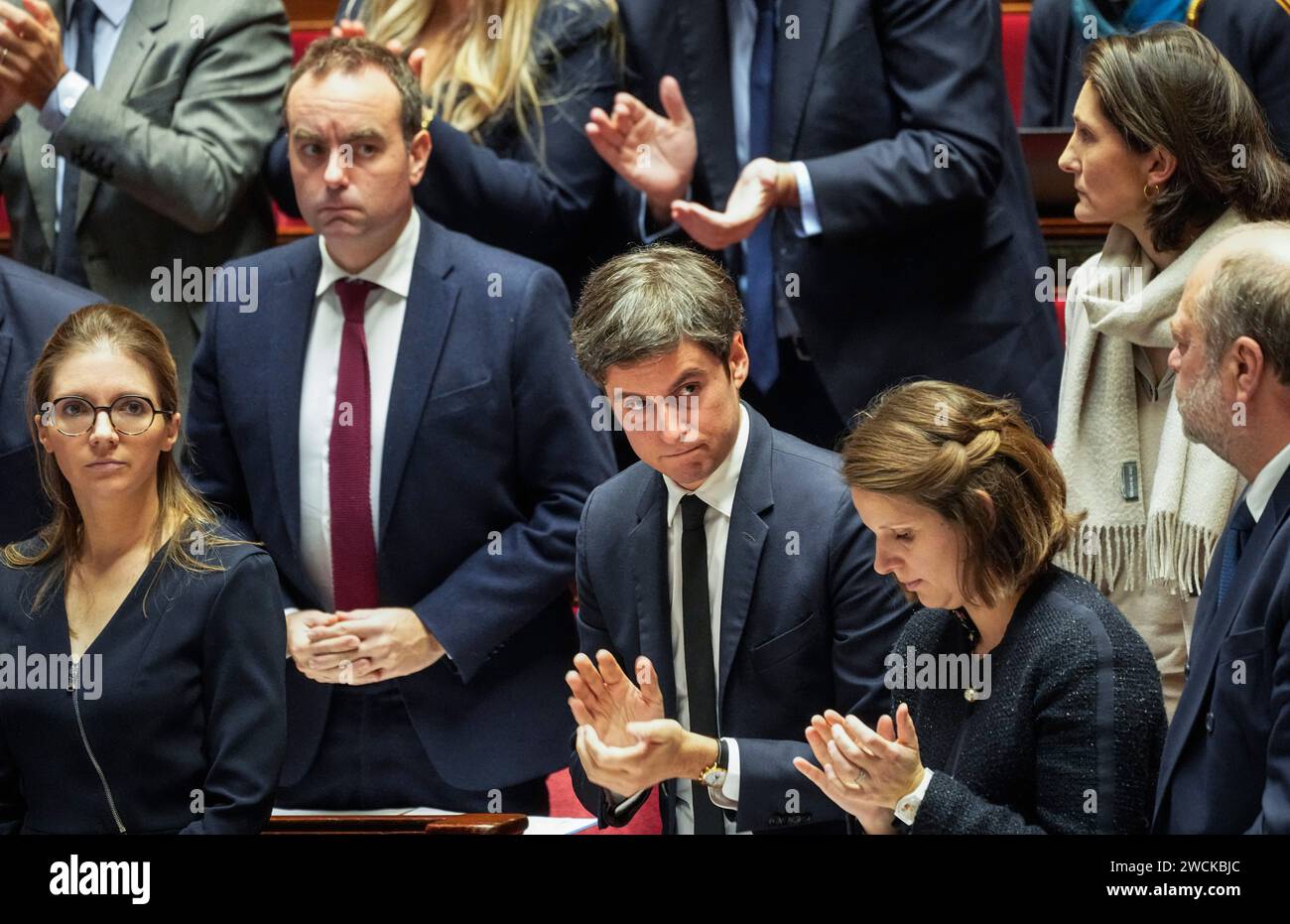 French Prime Minister Gabriel Attal, center, applauds among the ...