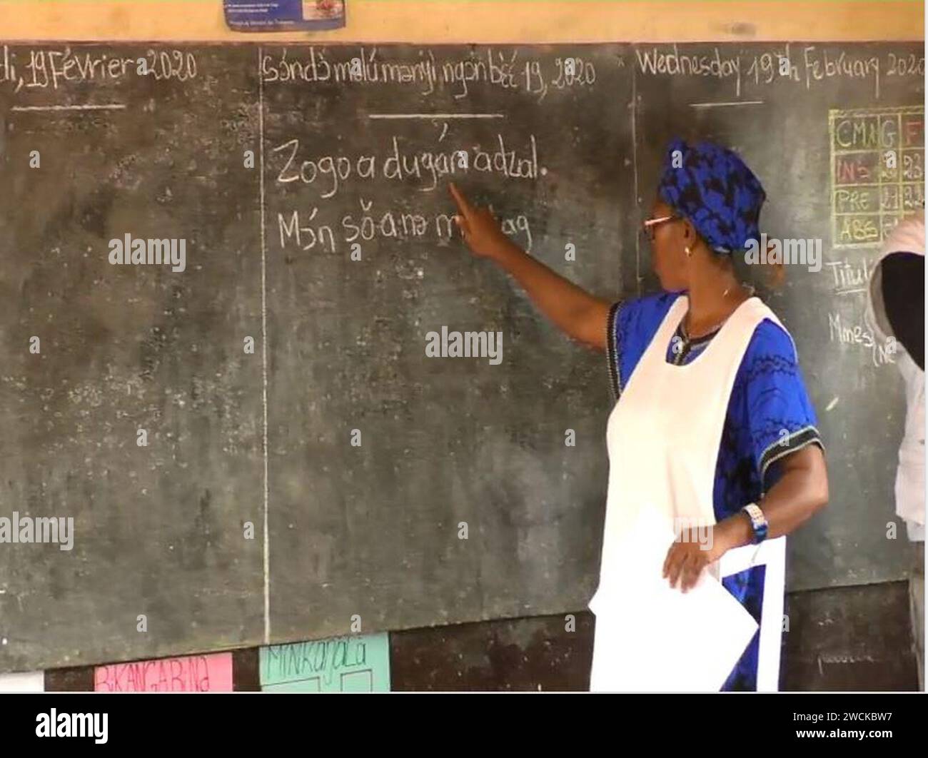 A teacher writes in Ewondo Stock Photo - Alamy