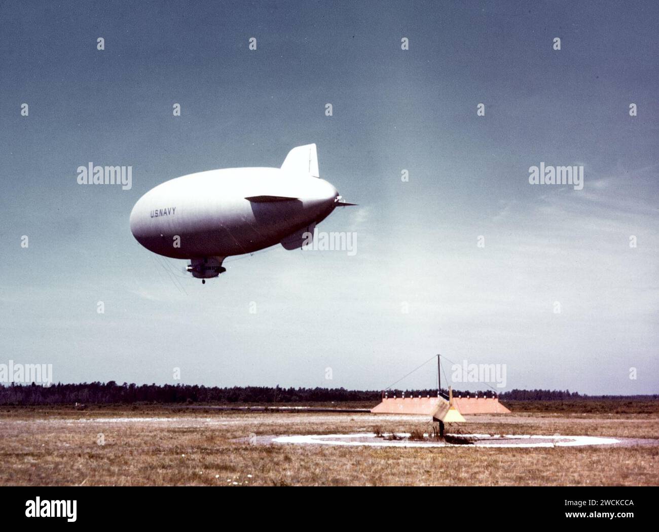 A U.S. Navy K-class blimp flies low over a naval air station, circa in ...