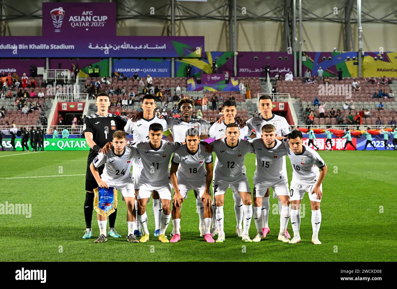 Doha, Qatar. 16th Jan, 2024. Players of Kyrgyzstan pose for group ...