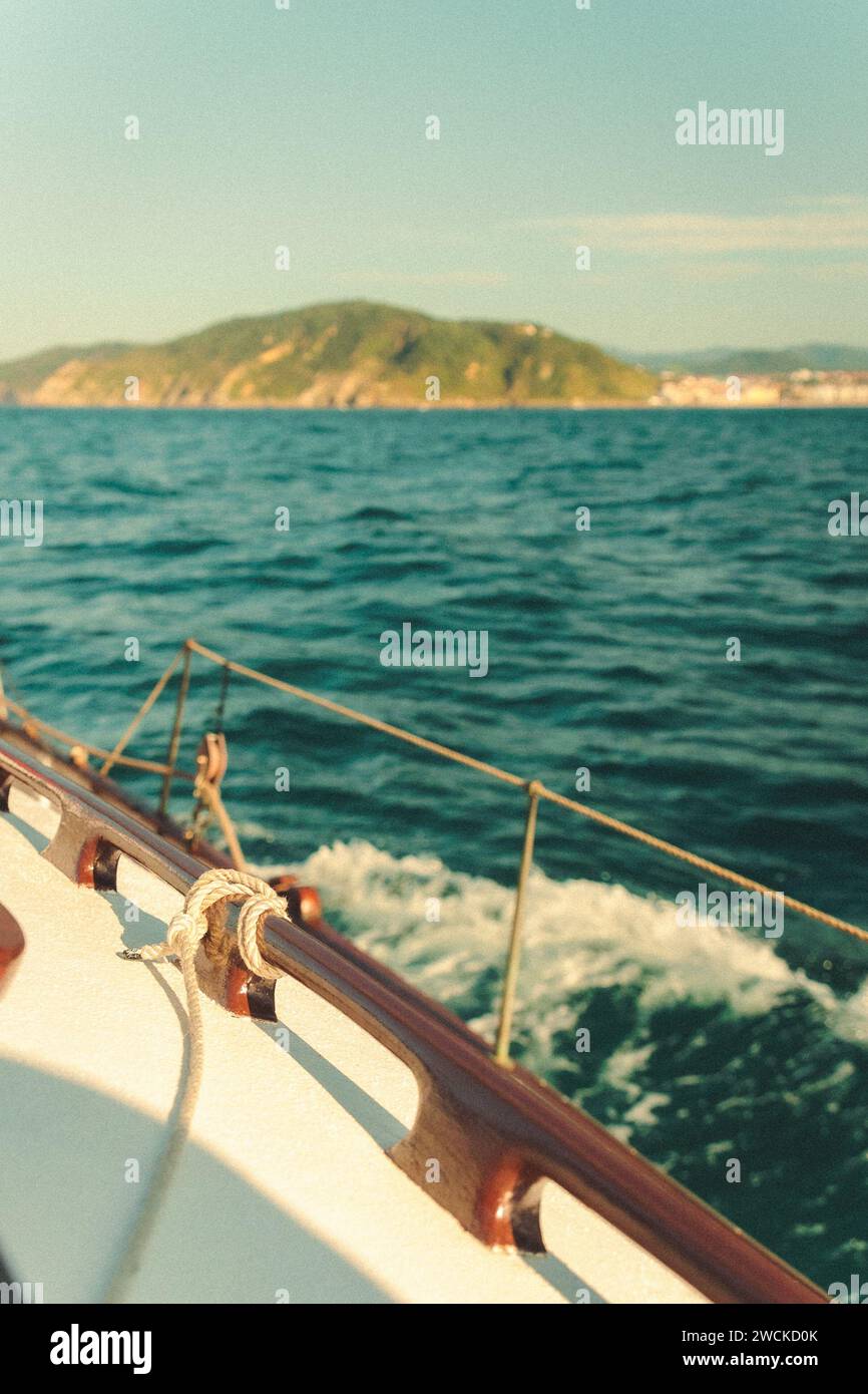 A scenic perspective of the ocean as seen from the deck of a sailing ...