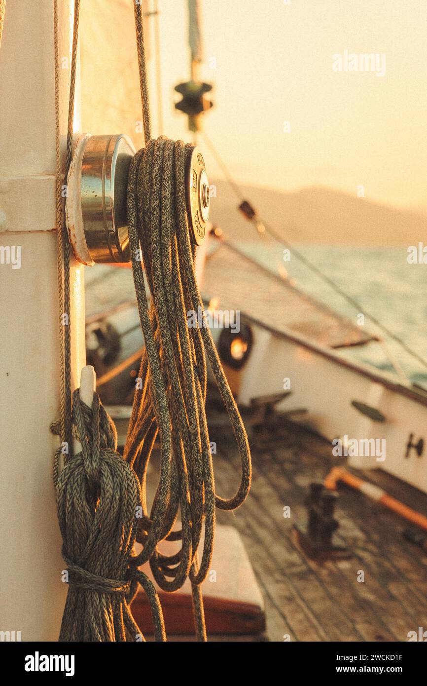 Rope secured to the sailboat's deck amidst open waters Stock Photo - Alamy