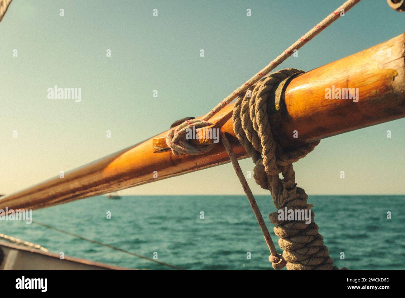 Sailboat rigging and masts on water with sails Stock Photo - Alamy