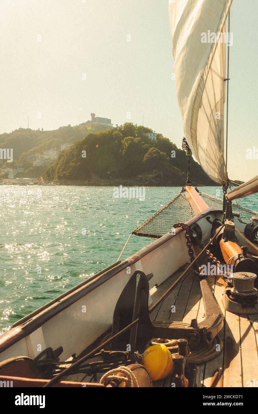 A man sailing on a boat in the serene waters Stock Photo - Alamy