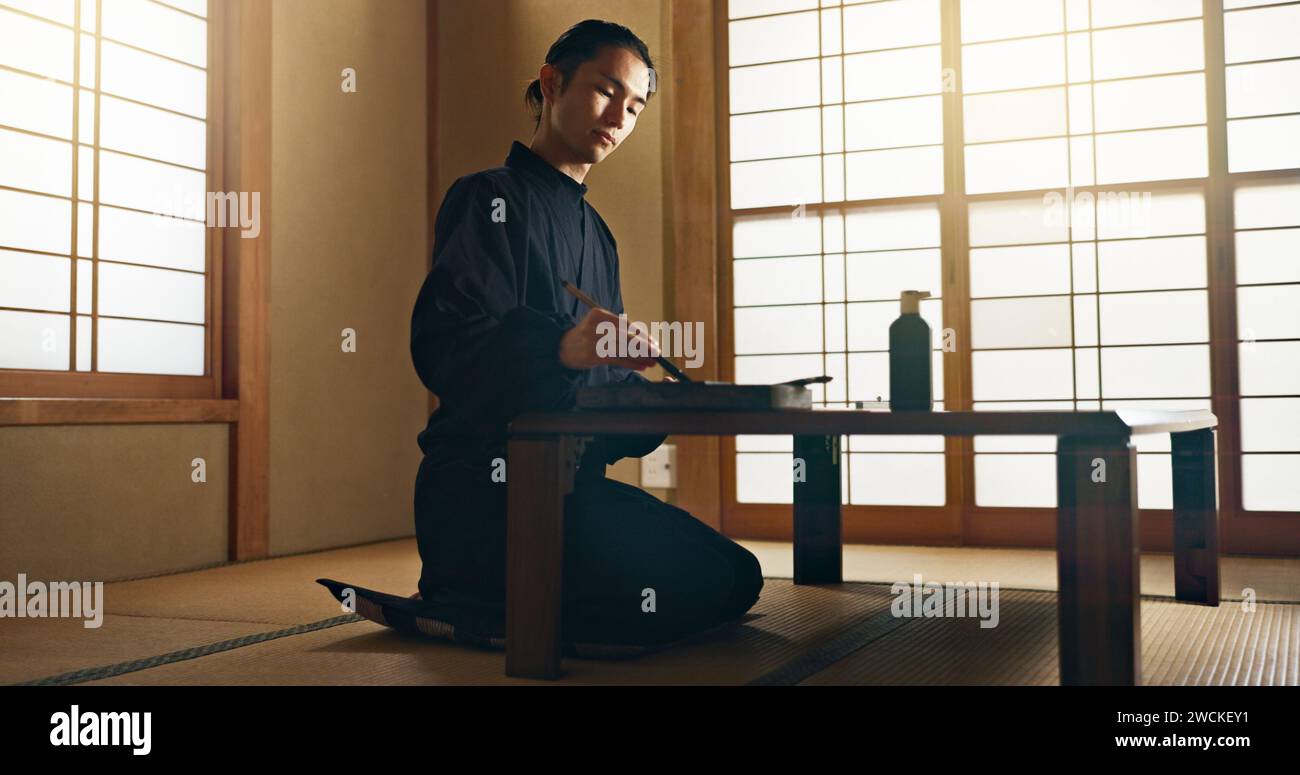 Man, calligraphy or creative Japanese artist in studio for art and ...