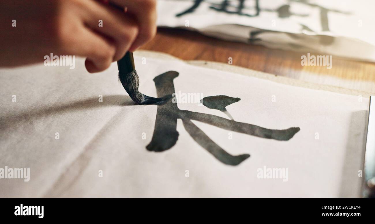 Hands, brush for writing and ancient font for art and script ...