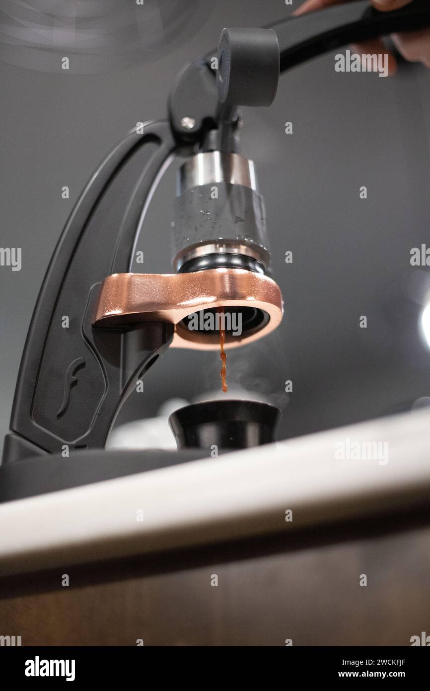 A low angle shot of an espresso machine creating aromatic coffee ...