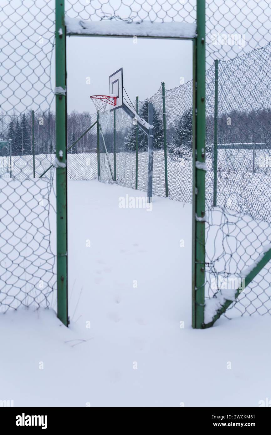 Outdoors basketball court covered with snow in winter, Finland Stock ...